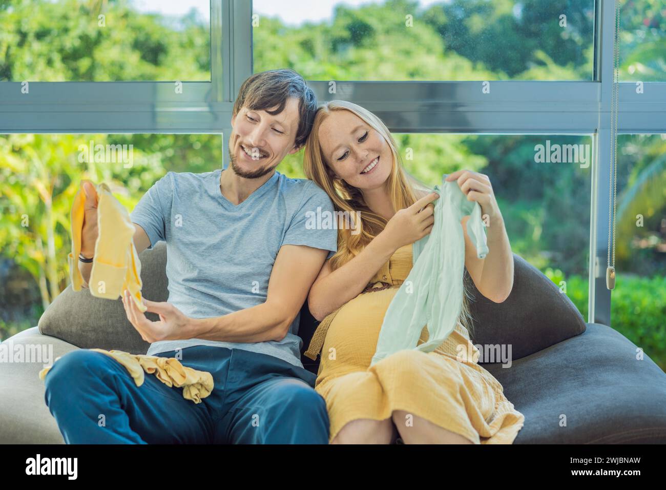In a heartwarming scene, the future mom and dad hold their unborn baby ...