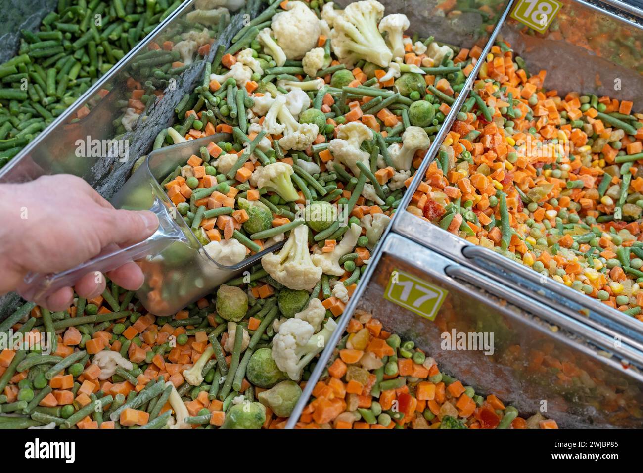 Frozen vegetable mix. Selling frozen vegetables in the fridge of a ...