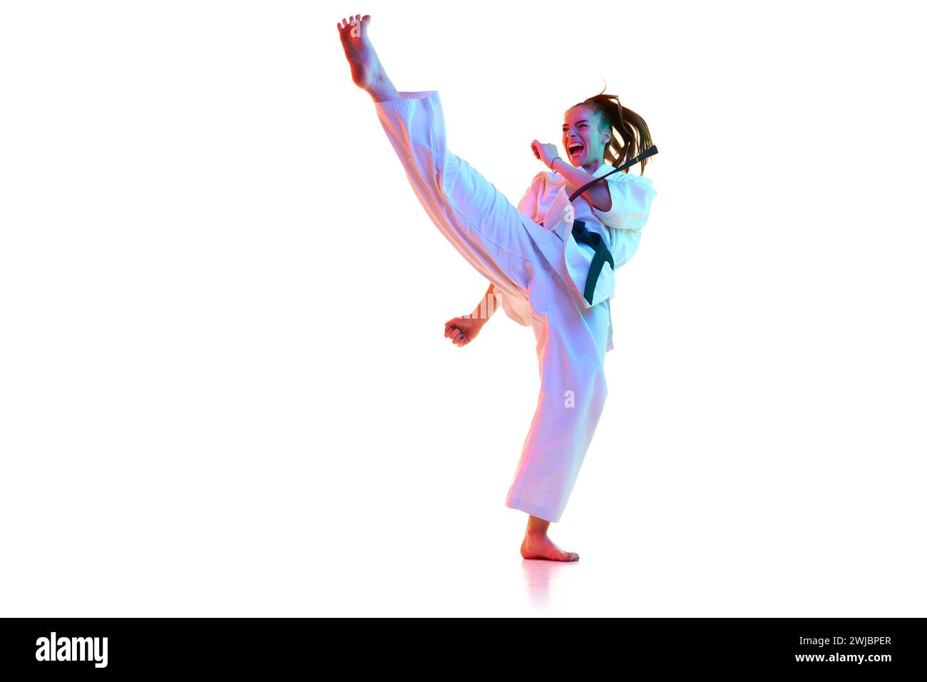 Side view portrait of karate fighter, taekwondo master shouting and ...