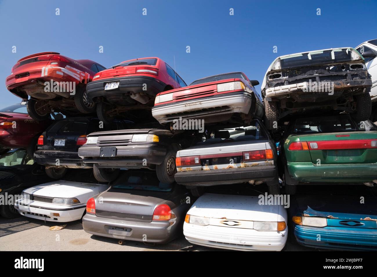 Stacked assorted automobiles at scrap metal recycling junkyard Stock ...