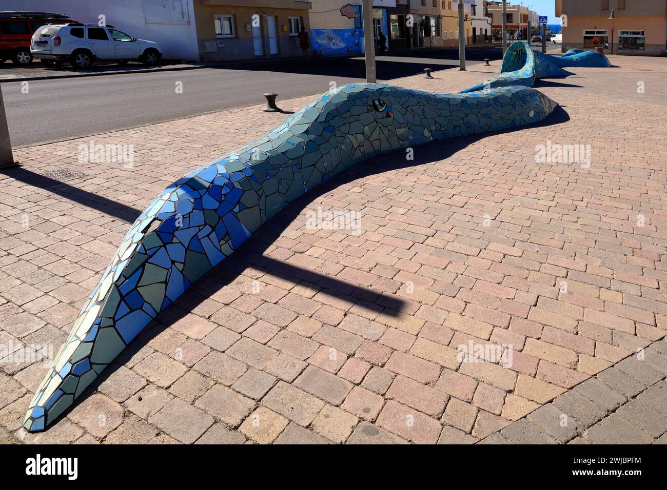 Chunky mosaic public artwork installation depicting fish in a public ...