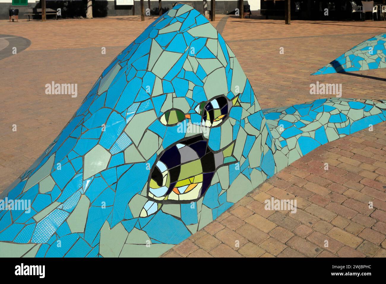 Chunky mosaic public artwork installation depicting fish in a public ...