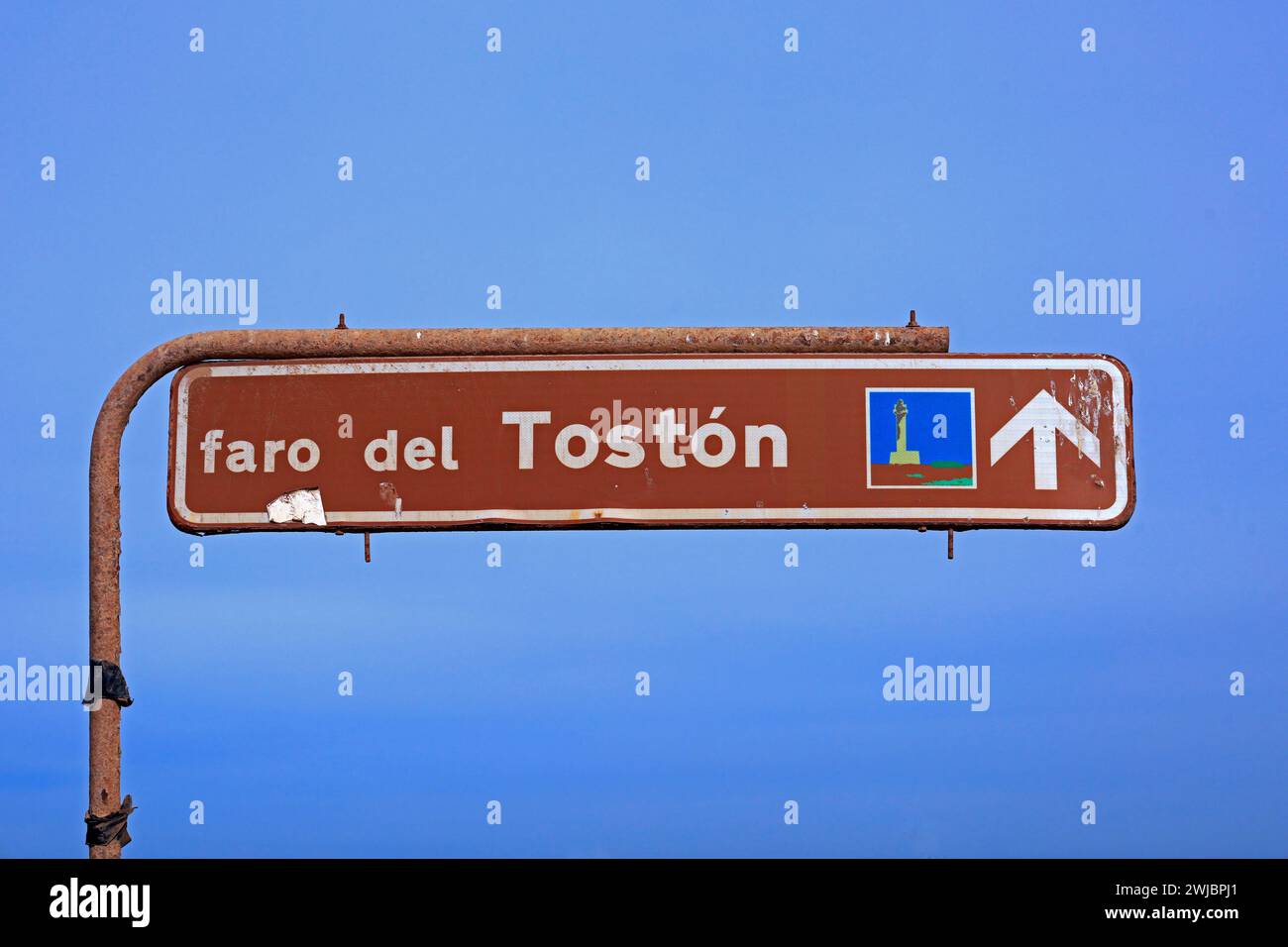 Road sign with directions to Faro Del Tostón lighthouse and fishing ...