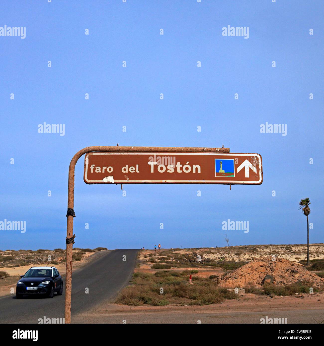 Road sign with directions to Faro Del Tostón lighthouse and fishing ...