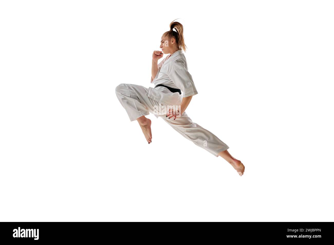 Black belt female kick hi-res stock photography and images - Alamy
