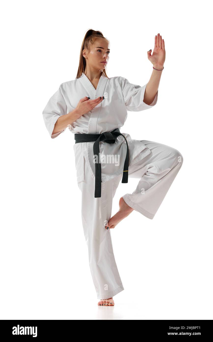 Balance. Master black belt Tae Kwon Do teacher in uniform standing on ...