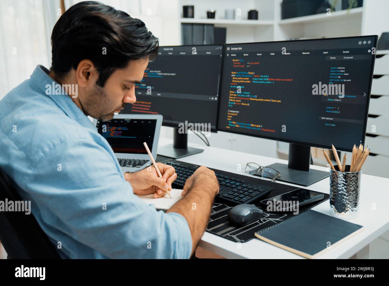 Smart IT developer writing data memo's software development on paper's ...