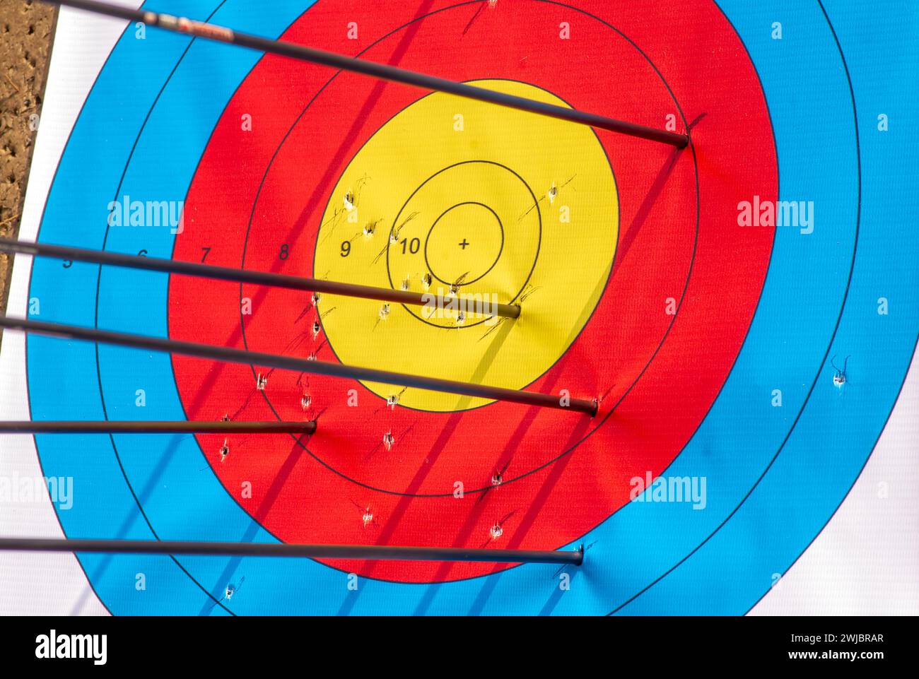 Many arrows hitting the archery target, bulls eye Stock Photo - Alamy