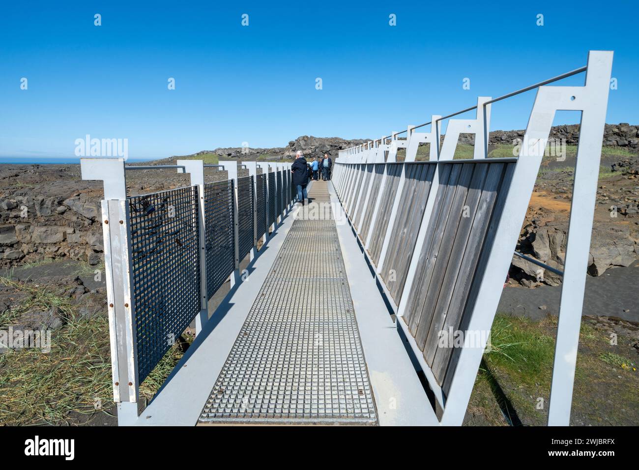 Hafnir, Iceland - July 11, 2023: Tourists visit the Bridge Between the ...