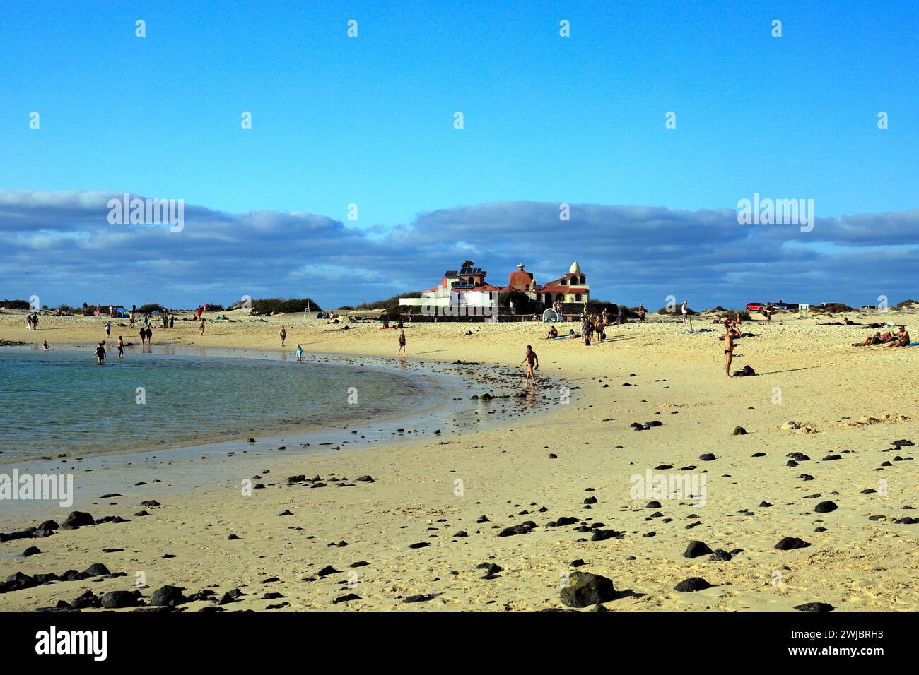 La Concha sandy beach with people in the distance, El Cotillo ...