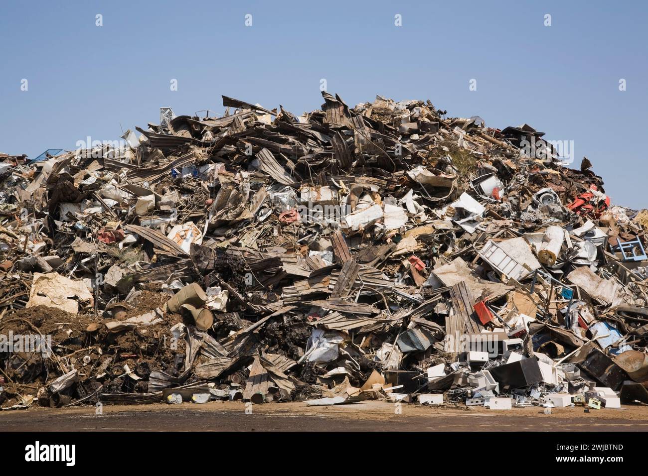 Large pile of discarded household and industrial items at scrap metal ...