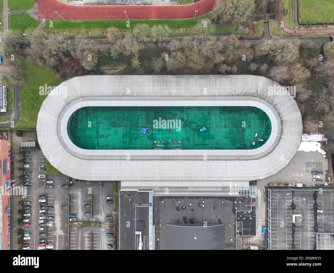 Top down birds eye view on partly covered 400 meter outdoor rink for ...