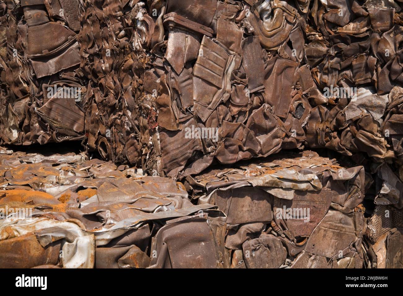 Bales of crushed and compacted rusted gas tanks at scrap metal ...