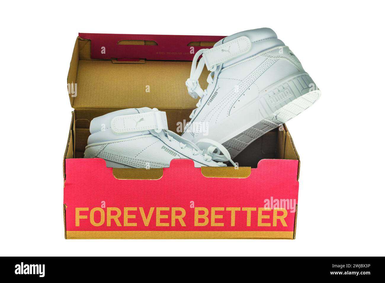 Close-up of white high-top Puma sneakers lying inside an open red box ...