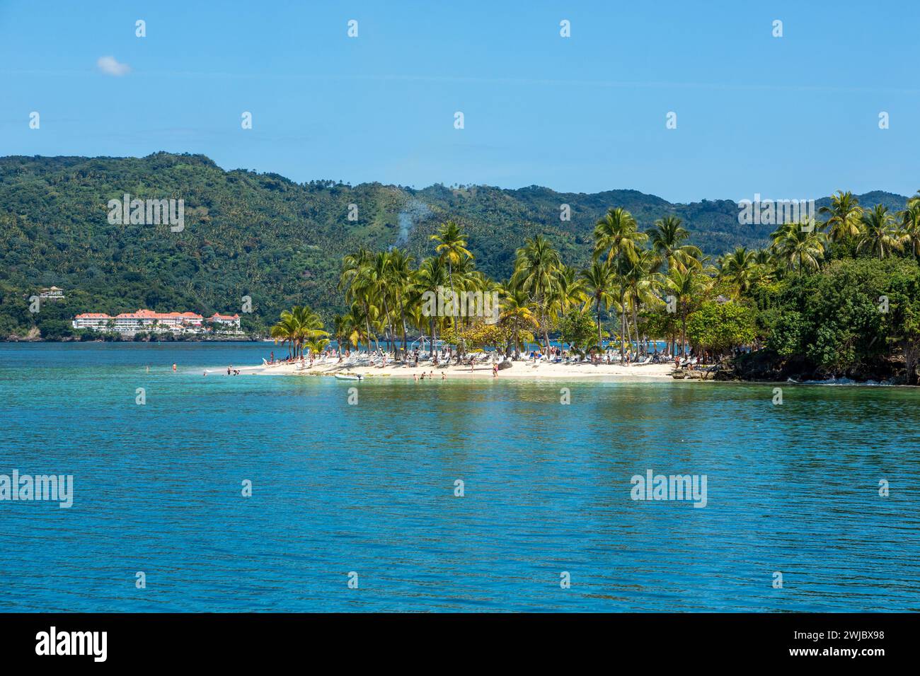 Tourists on the beach of Cayo Levantado, a resort island in the Bay of ...