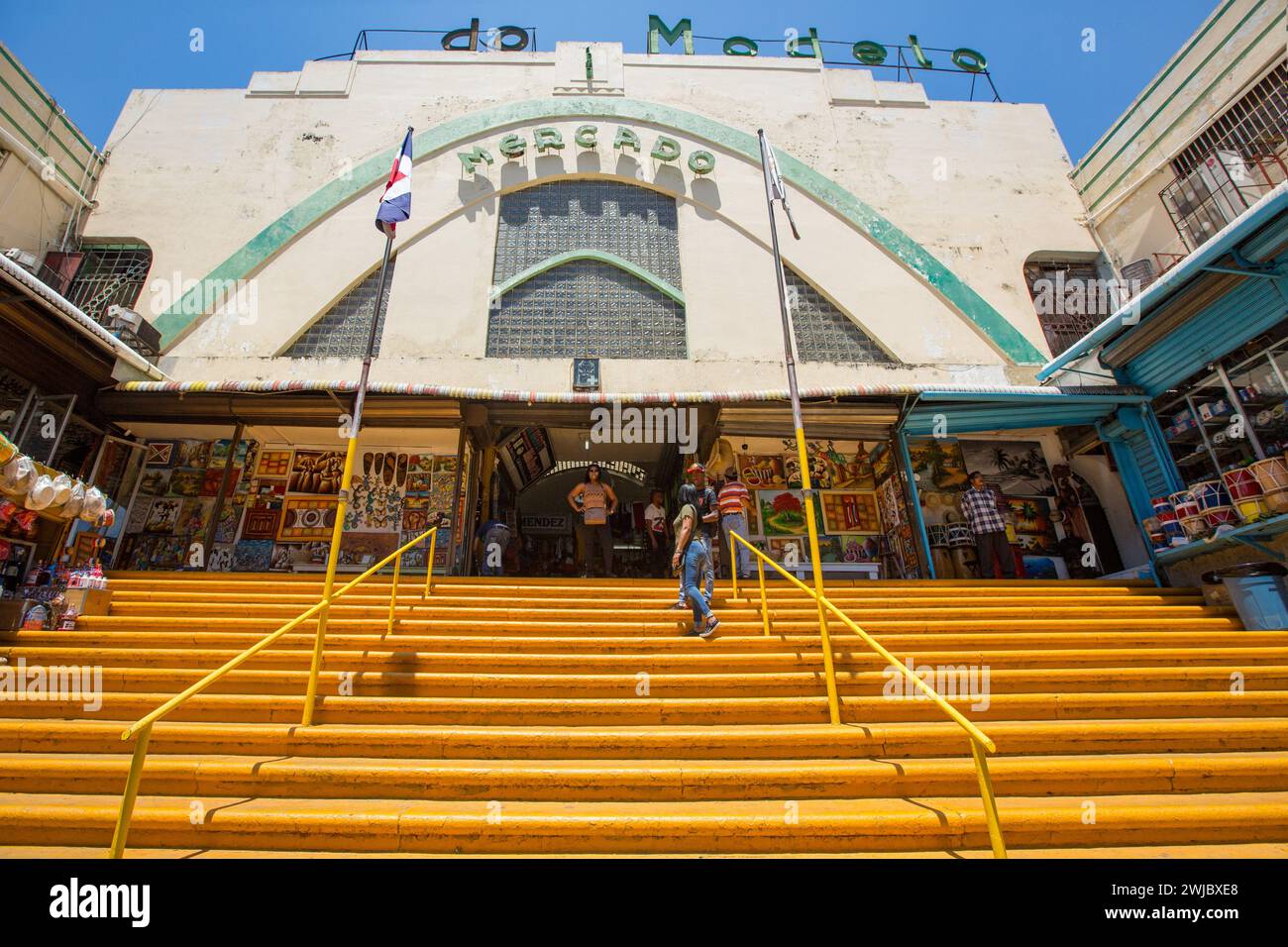 Shoppers descend the famous yellow steps leading up to the Mercado ...