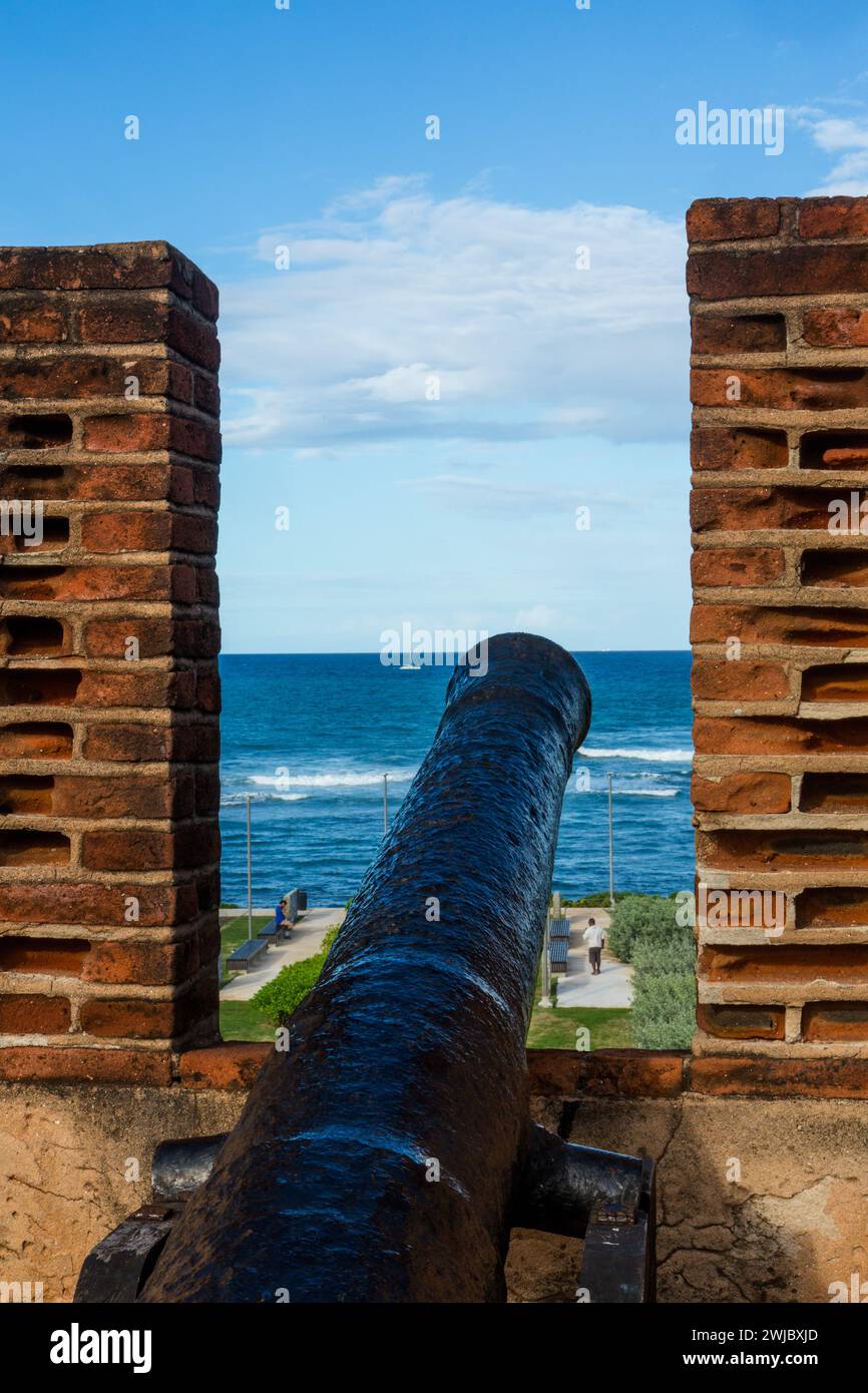 A colonial Spanish cannon overlooks the Atlantic Ocean at Fortaleza San ...