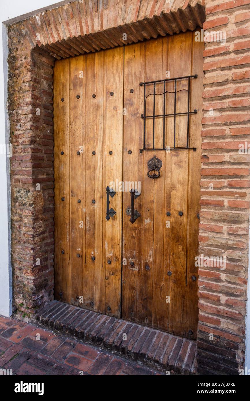 Wooden doorway in an old colonial building on Padre Billini Street ...