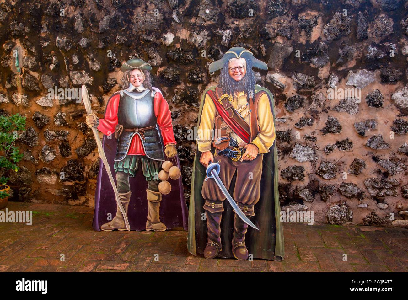 Tourists pose for a photo at as a pirate & Spanish soldier at Fortaleza ...