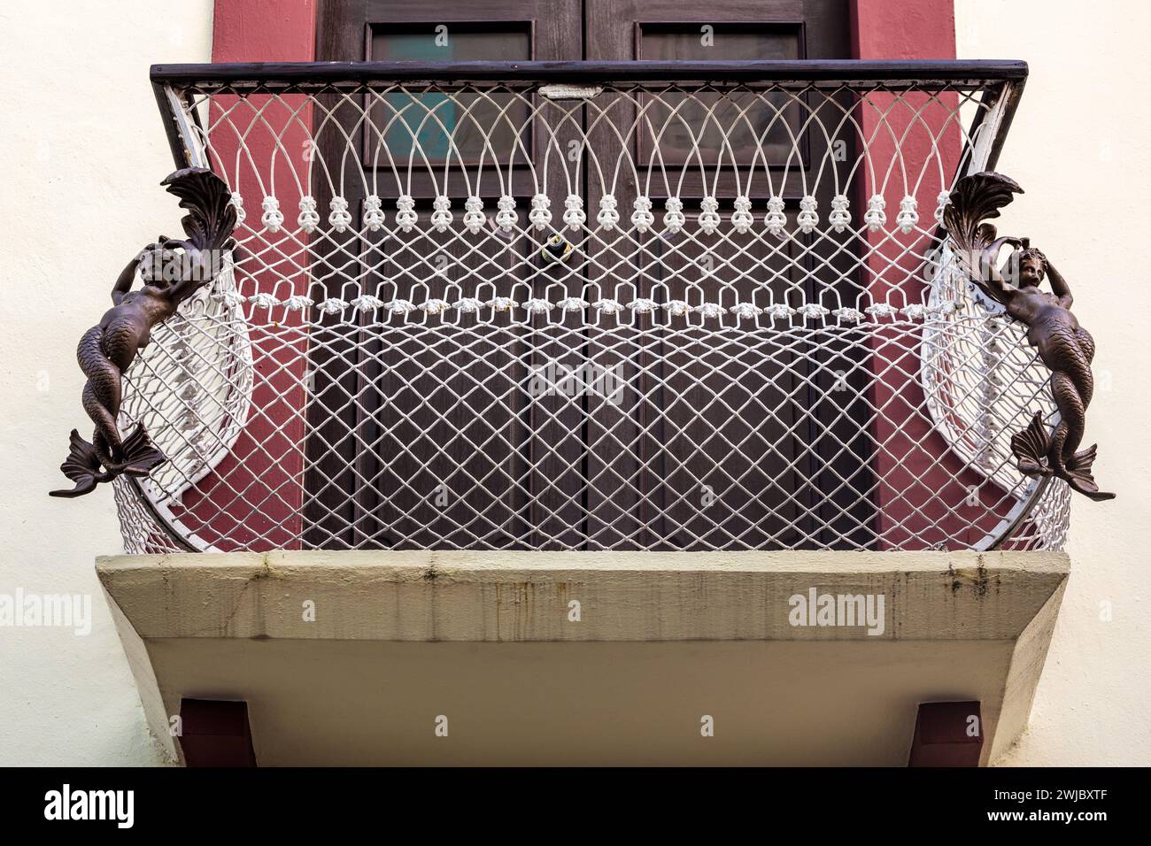 Cast mermaid statues on the balcony in the old Colonial City of Santo ...