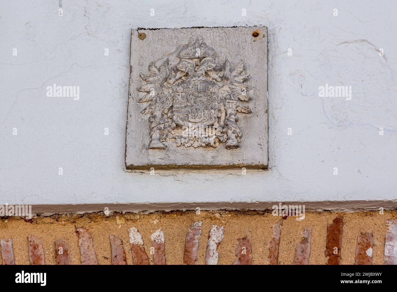 Stone carving of the coat of arms of King Charles I of Spain over the ...