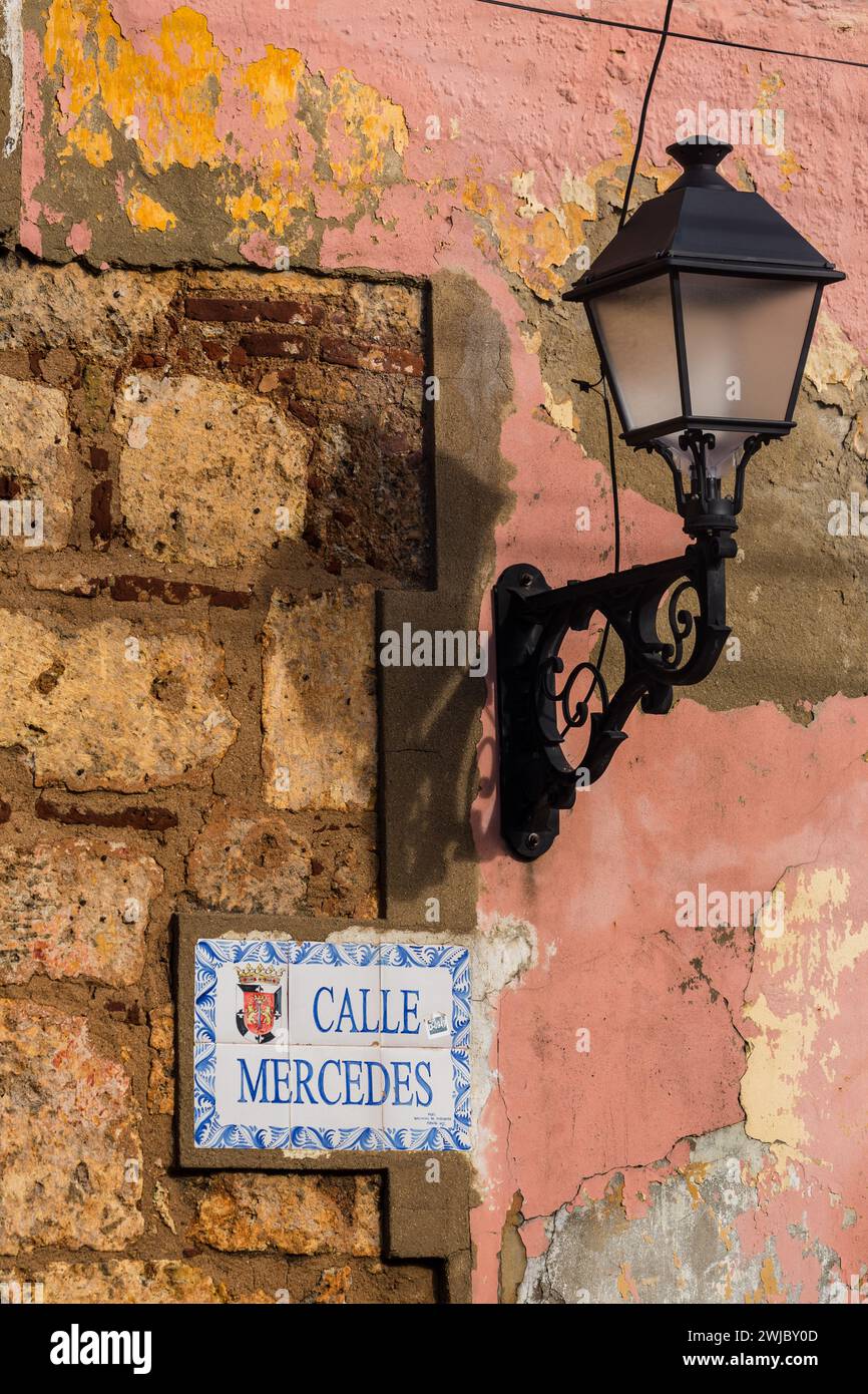 Tile street sign and street light in the old Colonial City of Santo ...