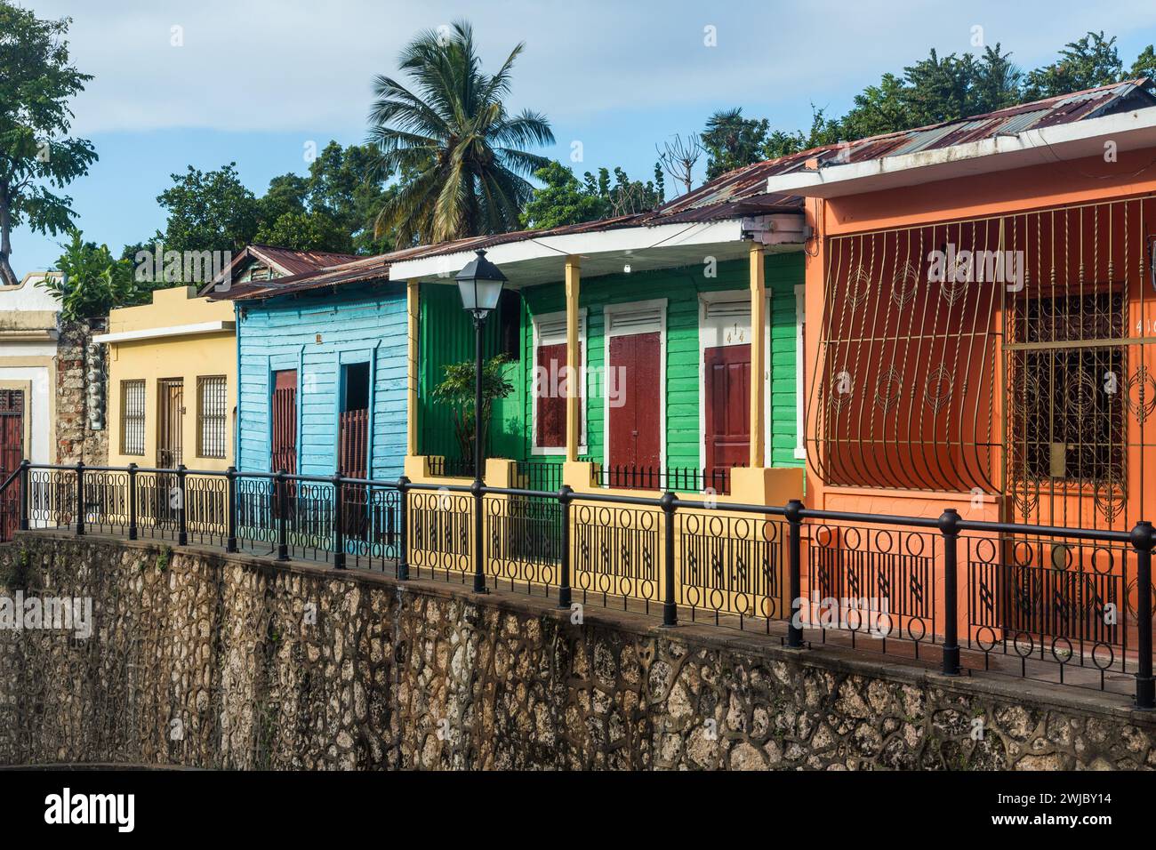 Colorfully painted old houses on Calle Hostos in the Colonial City of ...