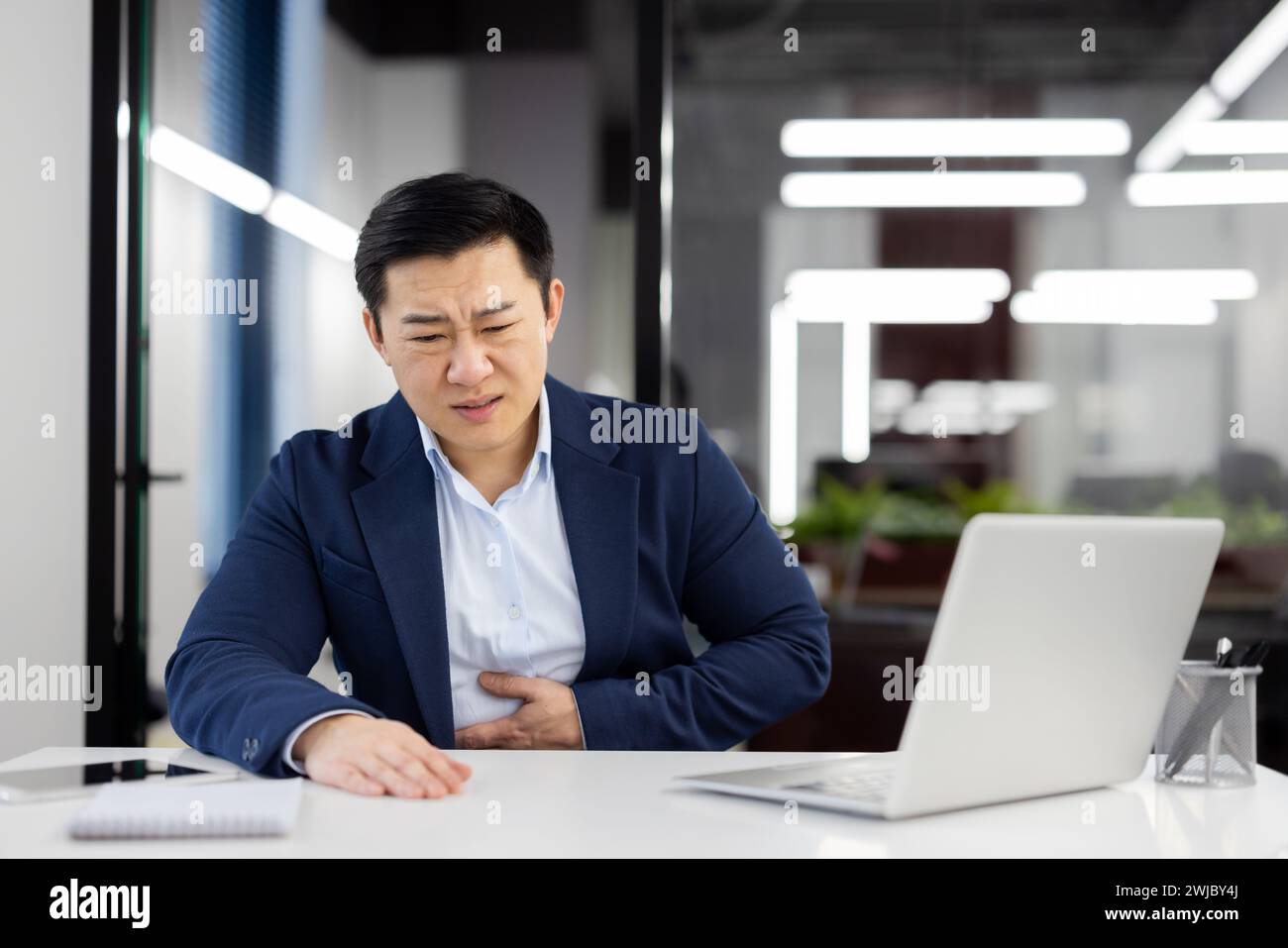 Man has severe stomach pain, nausea and food poisoning, businessman ...