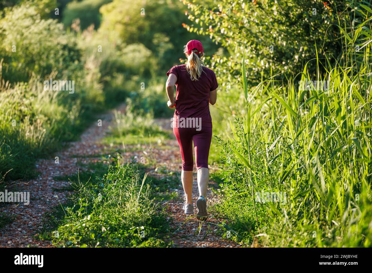 Woman cross road on green hi-res stock photography and images - Alamy