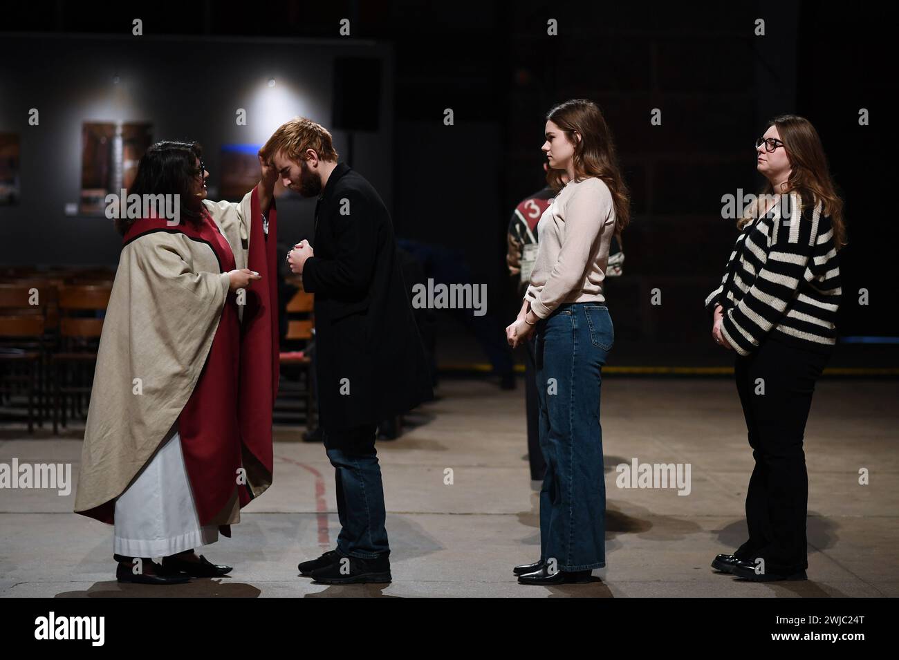 Parishioners receive the Imposition of the Ashes from Rev. Canon Eva ...
