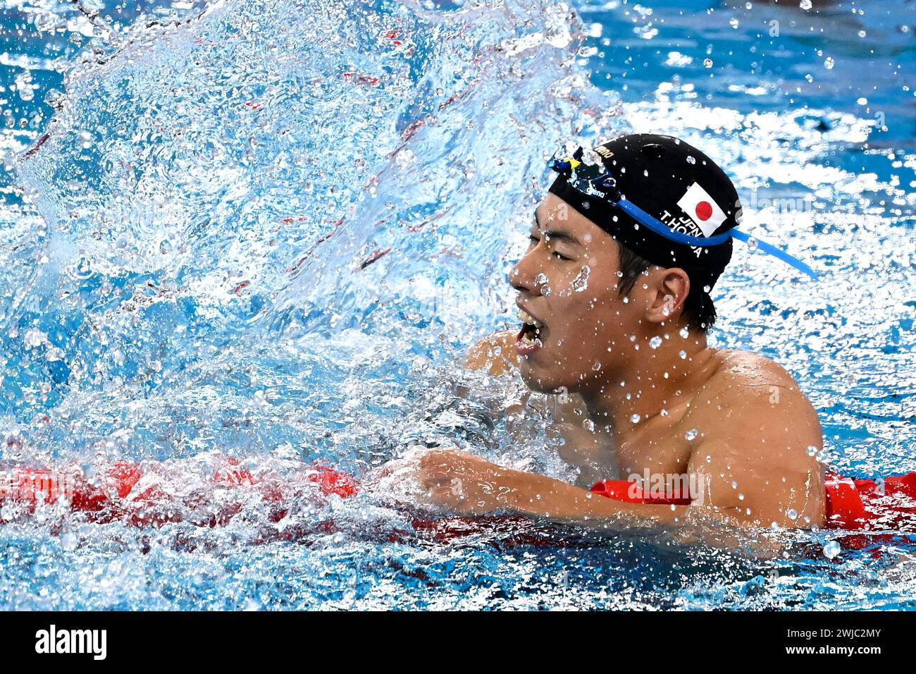 Tomoru Honda of Japan reacts after competing in the 200m Butterfly Men ...