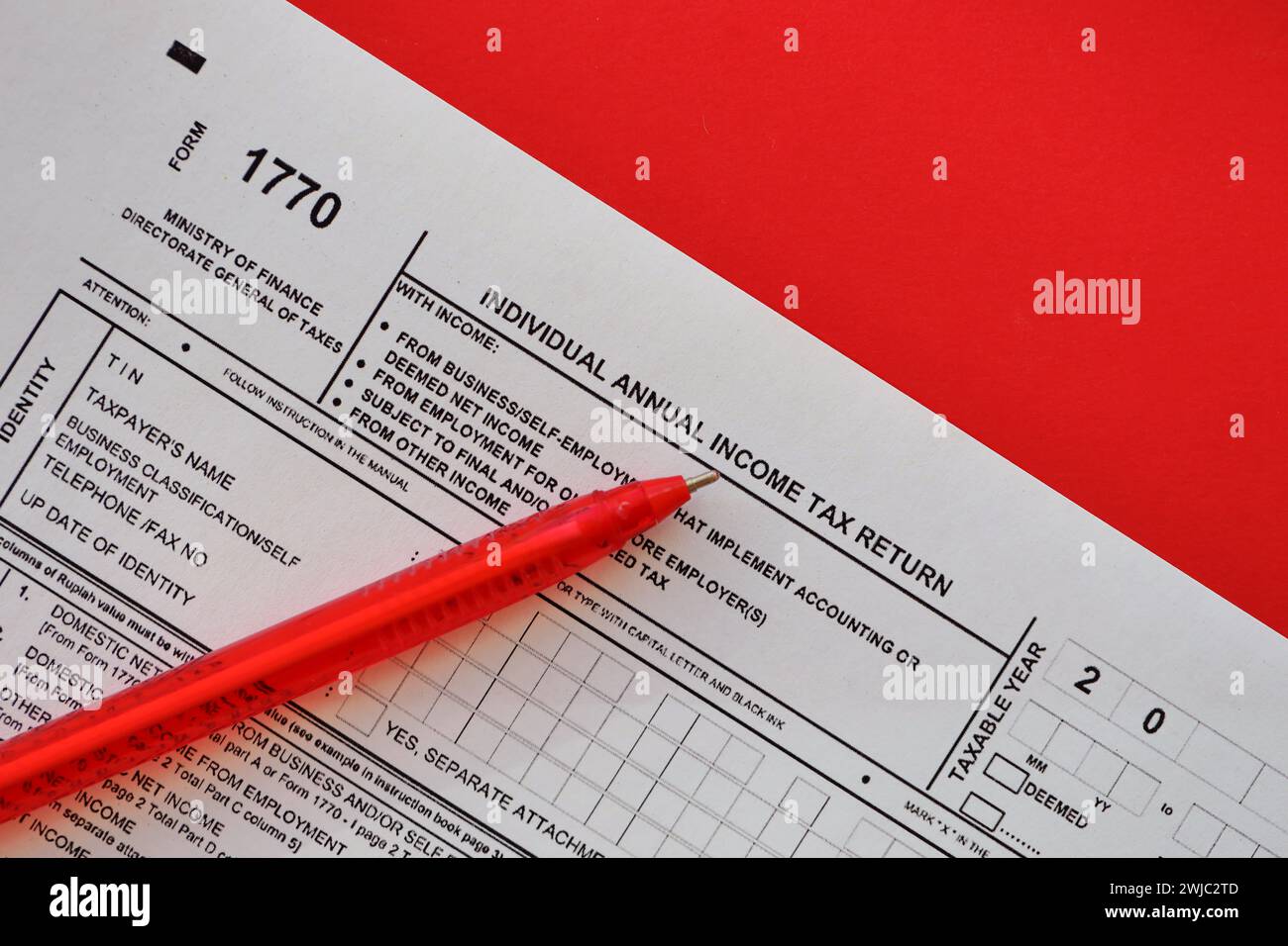 Indonesian tax form 1770 Individual Income Tax Return and pen on table ...