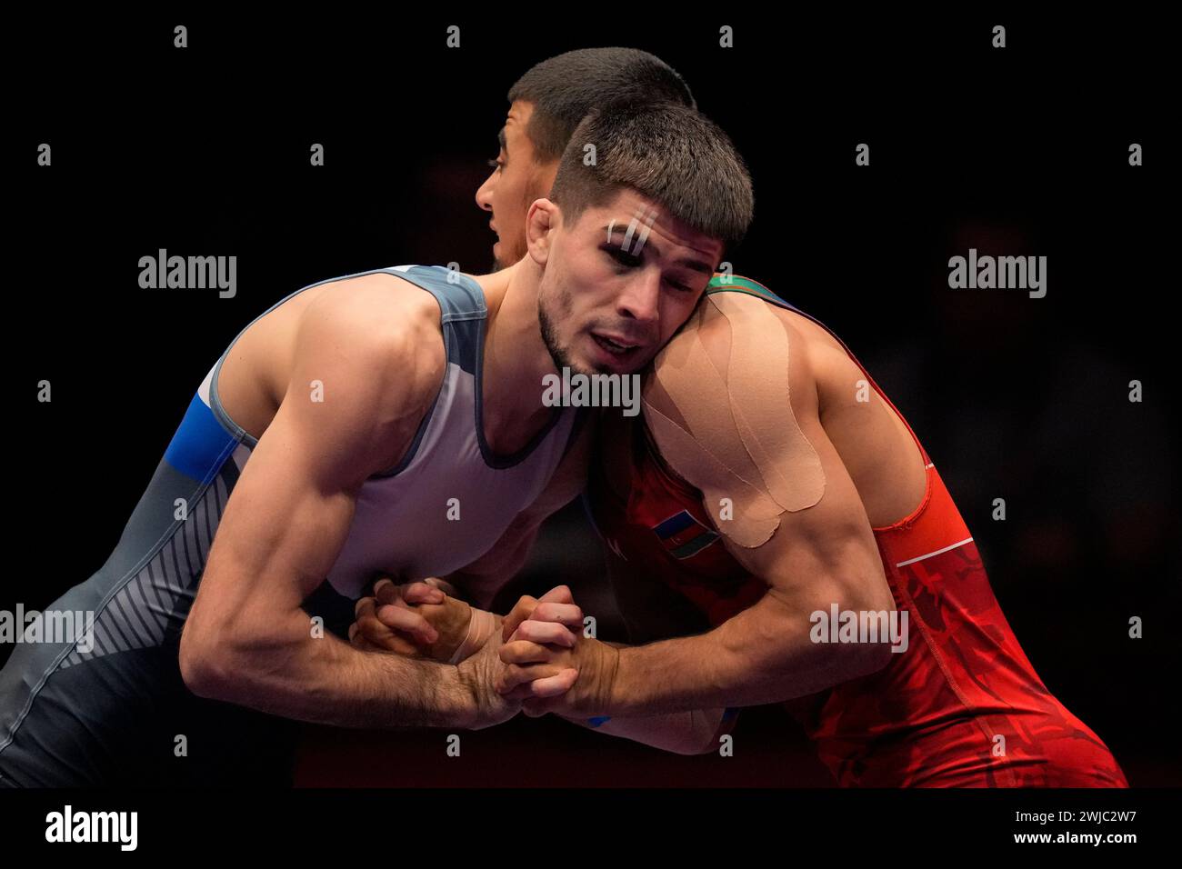 Azerbaijan's Hasrat Jafarov, right, competes against Individual Neutral ...