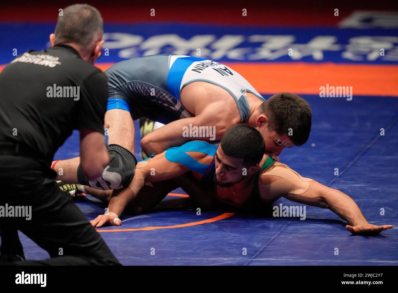 Azerbaijan's Hasrat Jafarov, bottom, competes against Individual ...