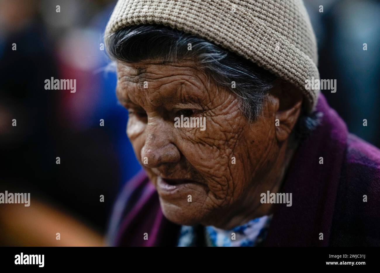 A cross of ashes marks the forehead of a person attending Ash Wednesday ...