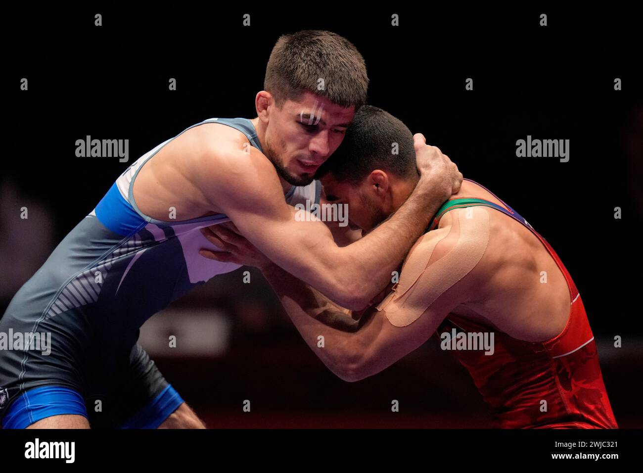 Azerbaijan's Hasrat Jafarov, right, competes against Individual Neutral ...