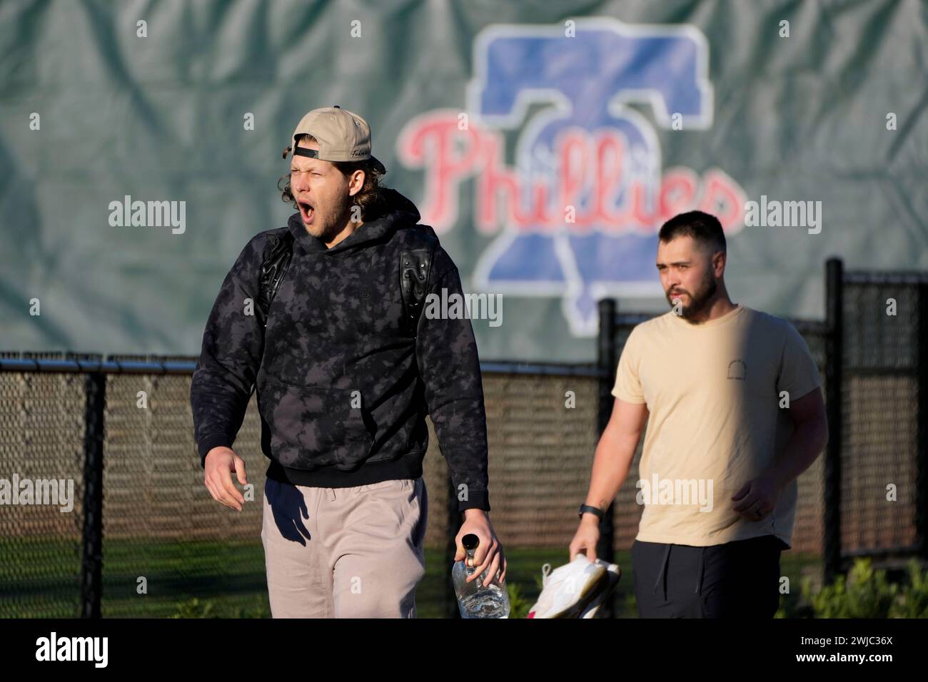 Philadelphia Phillies first baseman Alec Bohm, left, yawns as he ...