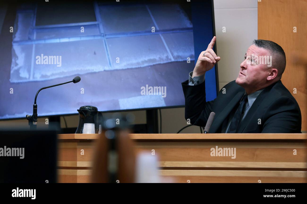 Scott Riley testifies in front of a photo of the ceiling of Unit 1 at ...