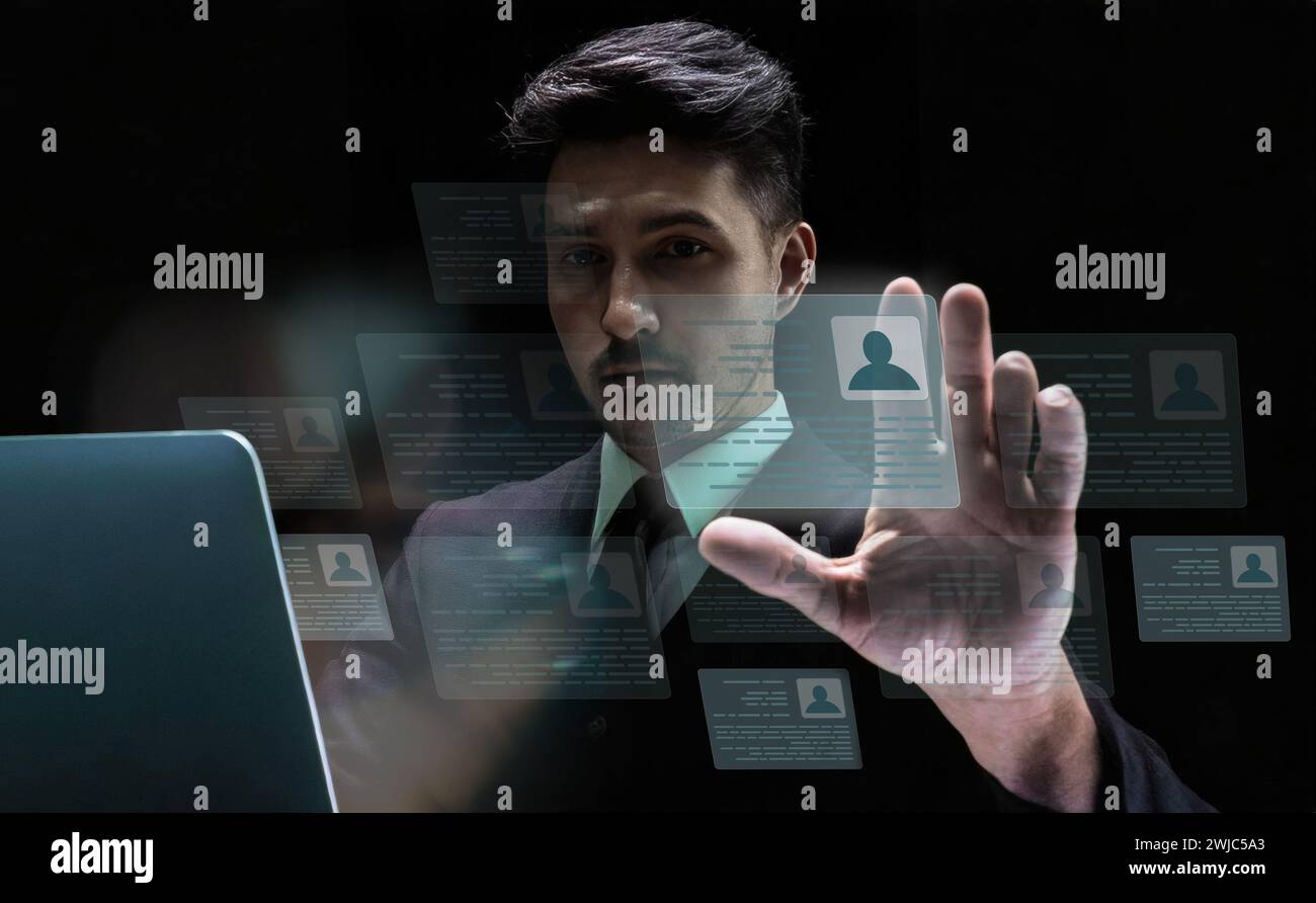 Businessman choose a person among candidates on a virtual pad display ...