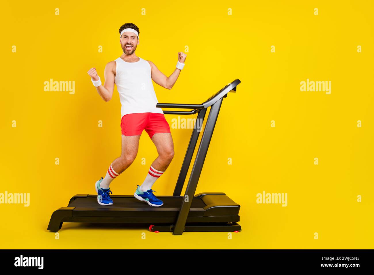 Full size photo of crazy sportive person exercise treadmill raise fists ...