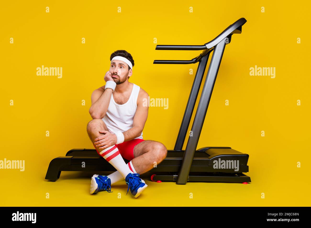 Full body portrait of minded lazy young man sit treadmill look empty ...