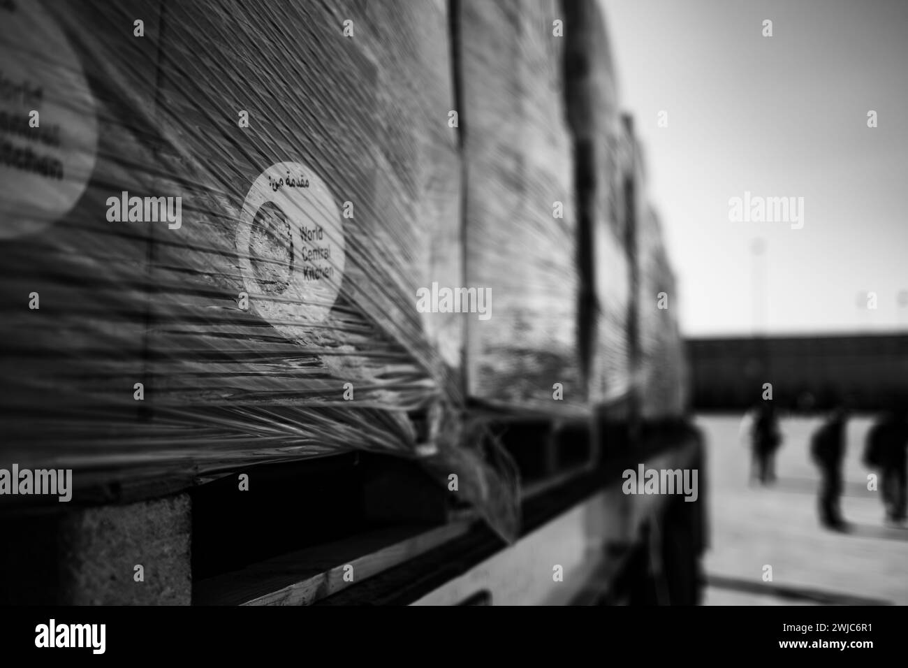 A black and white close-up image of humanitarian aid packages labeled ...