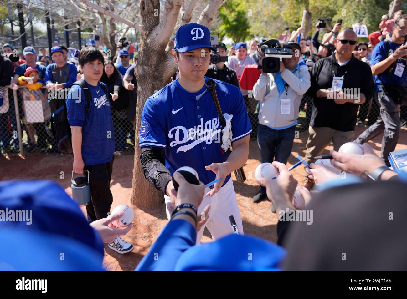 Los Angeles Dodgers designated hitter Shohei Ohtani signs autographs ...