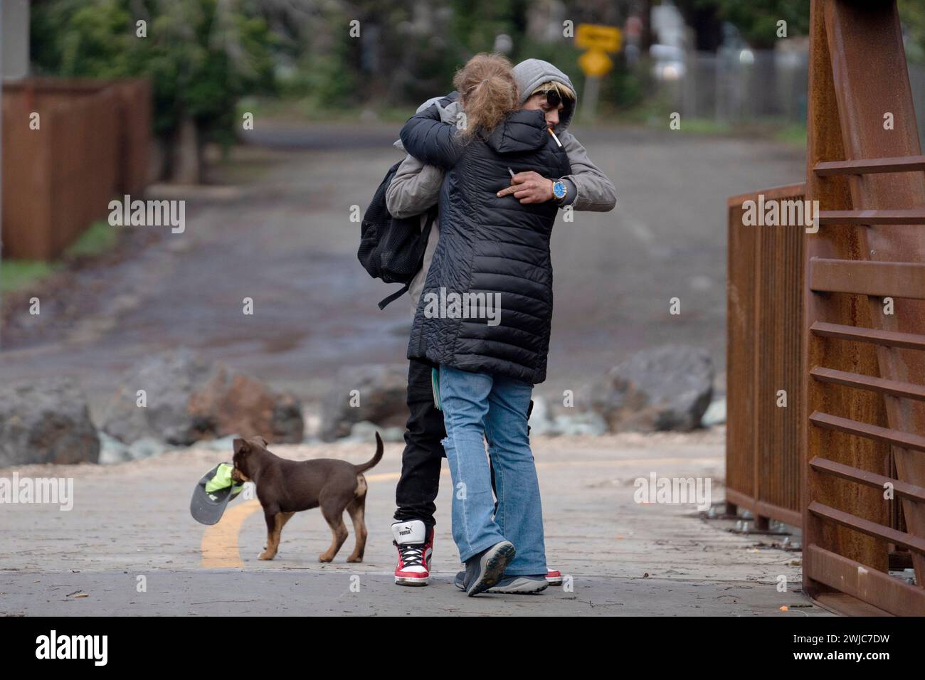 Brett, last name not given, who is homeless, left, is hugged by Beth ...