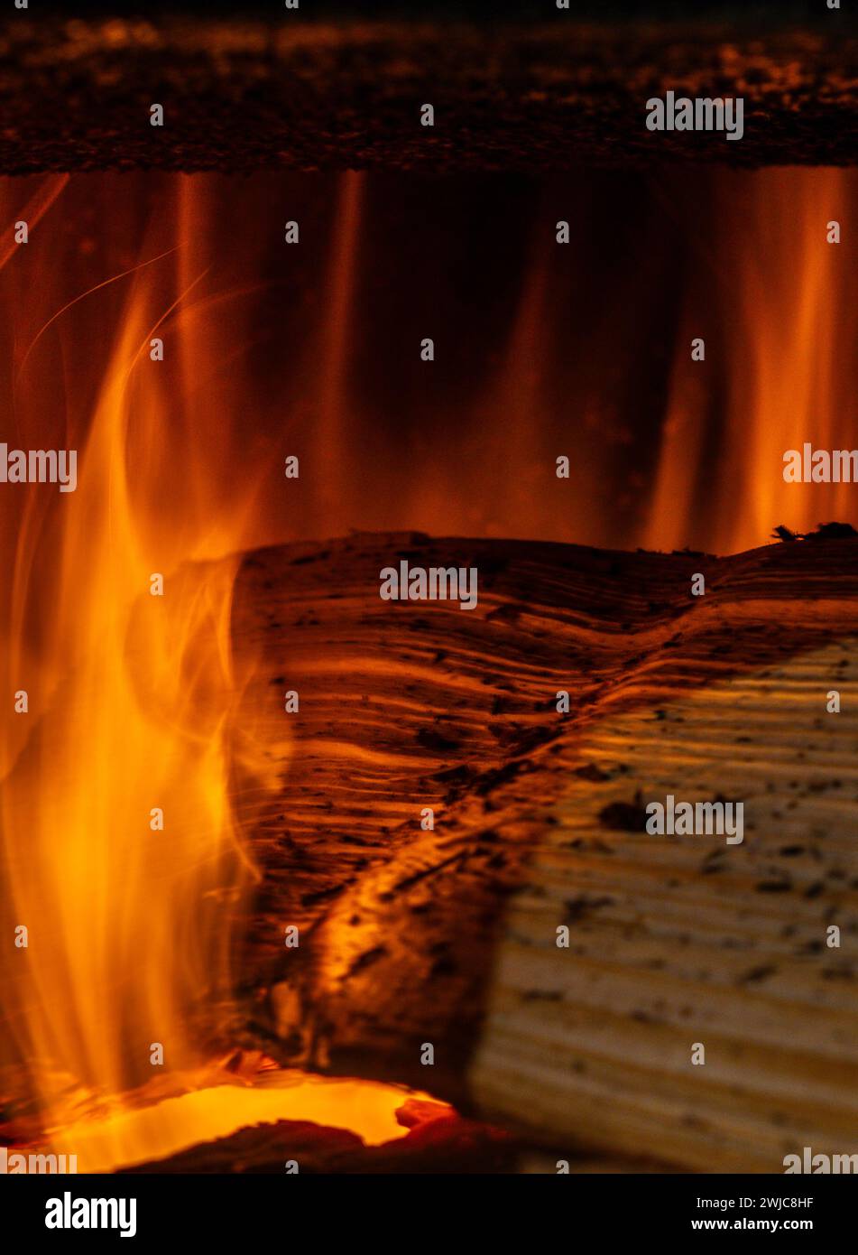 The process of burning wood in a rustic stove Stock Photo - Alamy