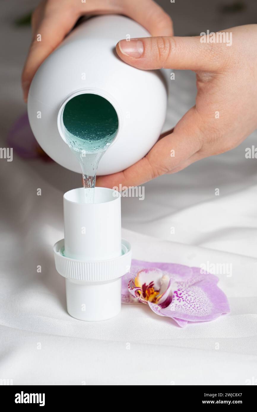 The process of pouring natural eco gel liquid laundry detergent from ...