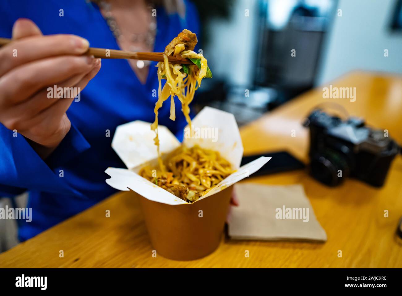 Asian girl eating noodles restaurant hi-res stock photography and ...