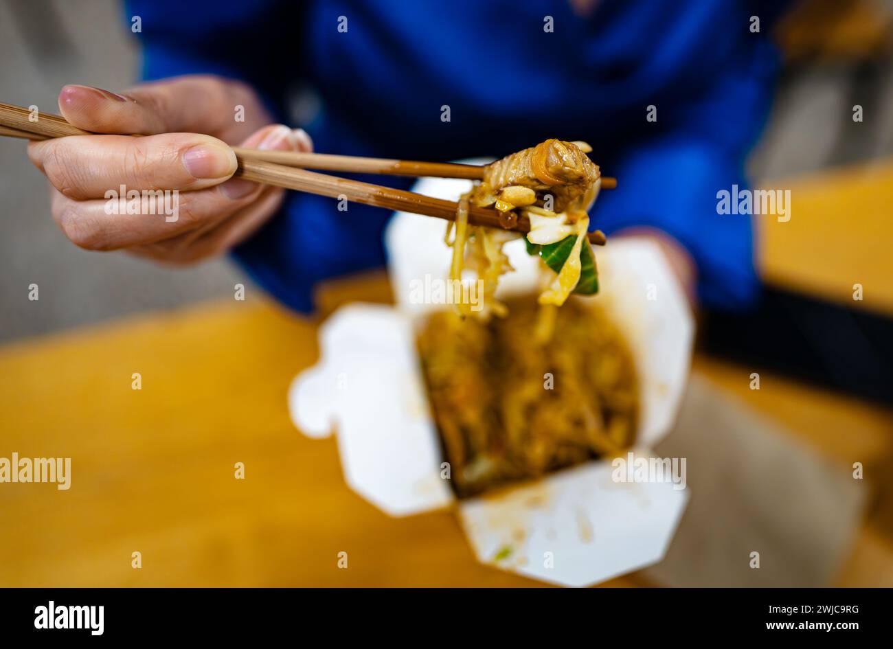 Asian girl eating noodles restaurant hi-res stock photography and ...