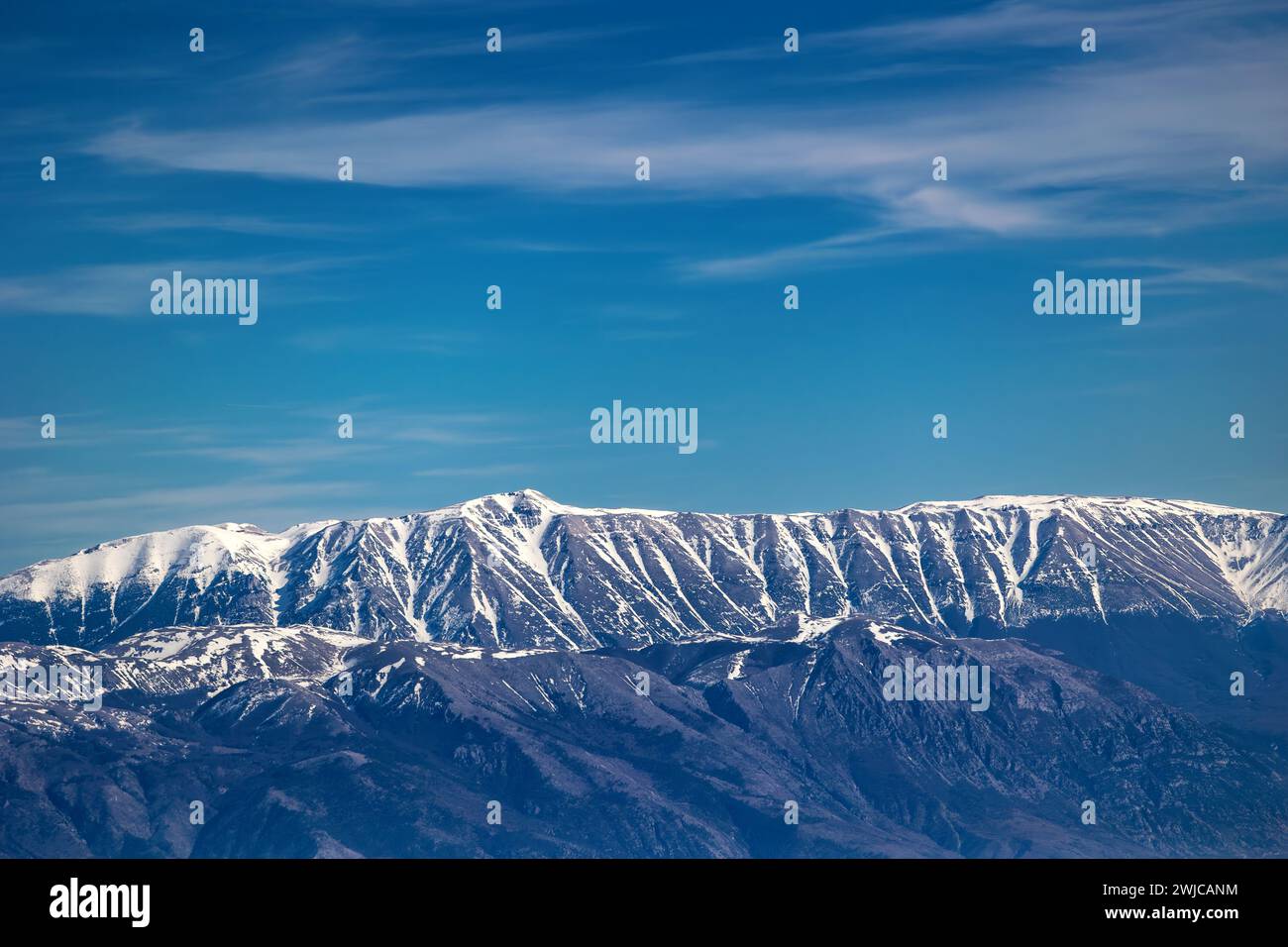 Snowy mountain panorama on blue sky background. Central Italian ...