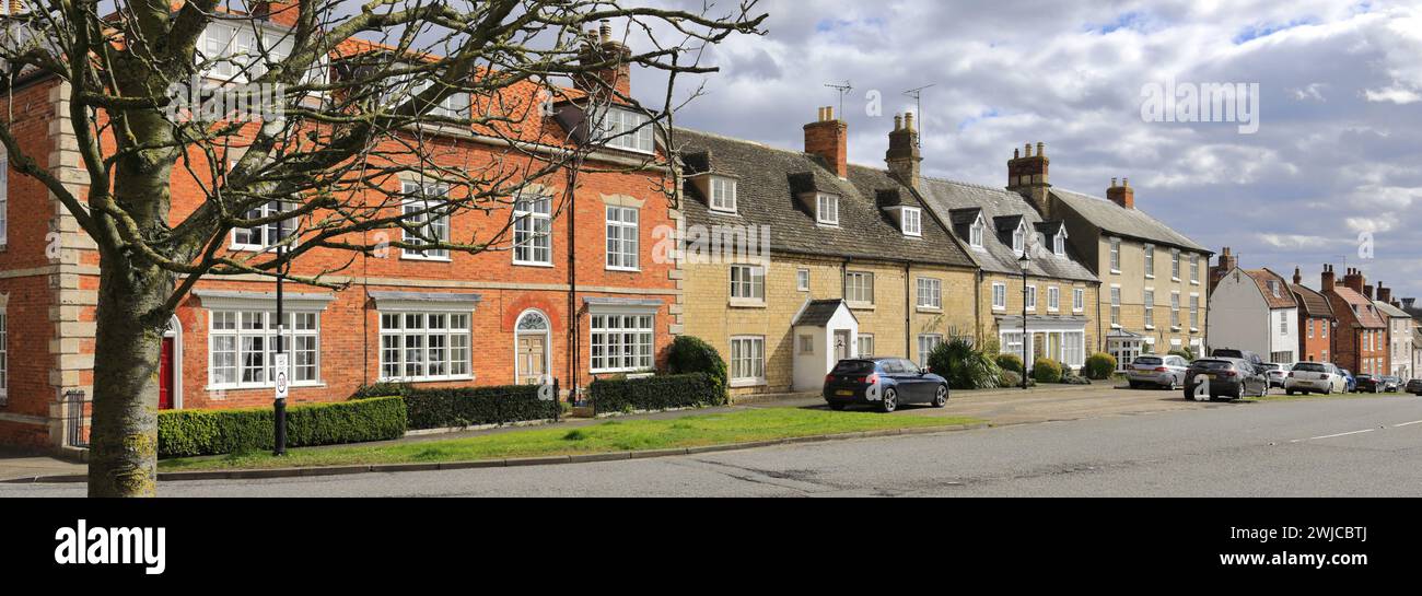 Spring Daffodils around the buildings of Folkingham village green ...